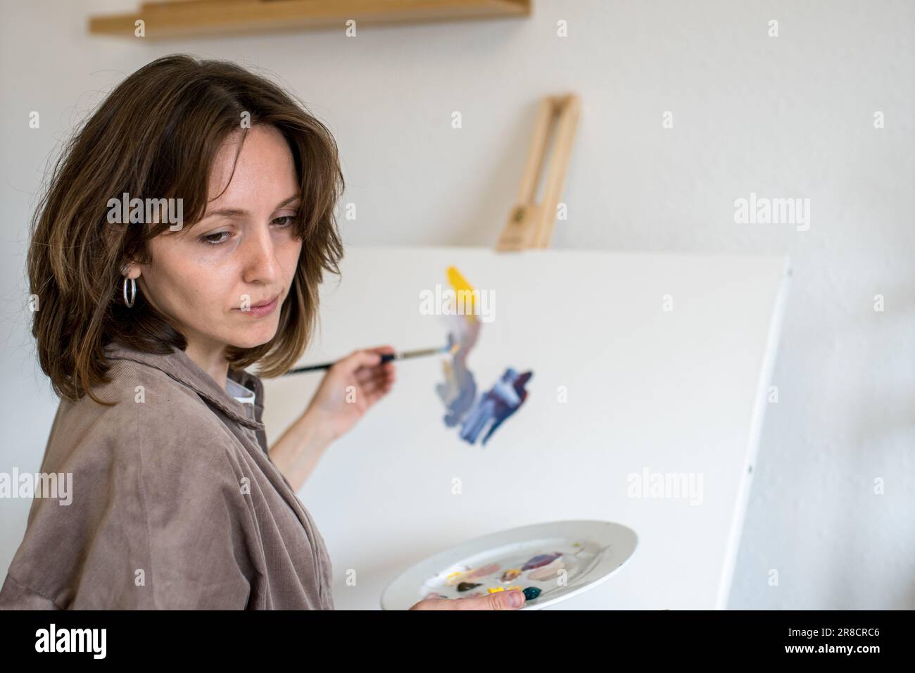 Woman painting bedroom wall paint hi-res stock photography and images ...