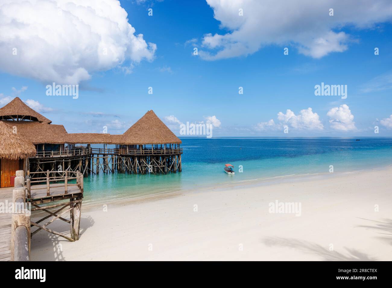 A beautiful tropical beach with white sand and clear blue water on the ...