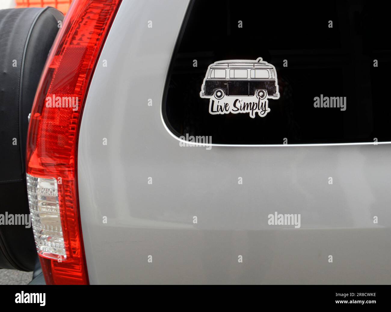 A "Live Simply" vinyl sticker or decal made with an image of a ...