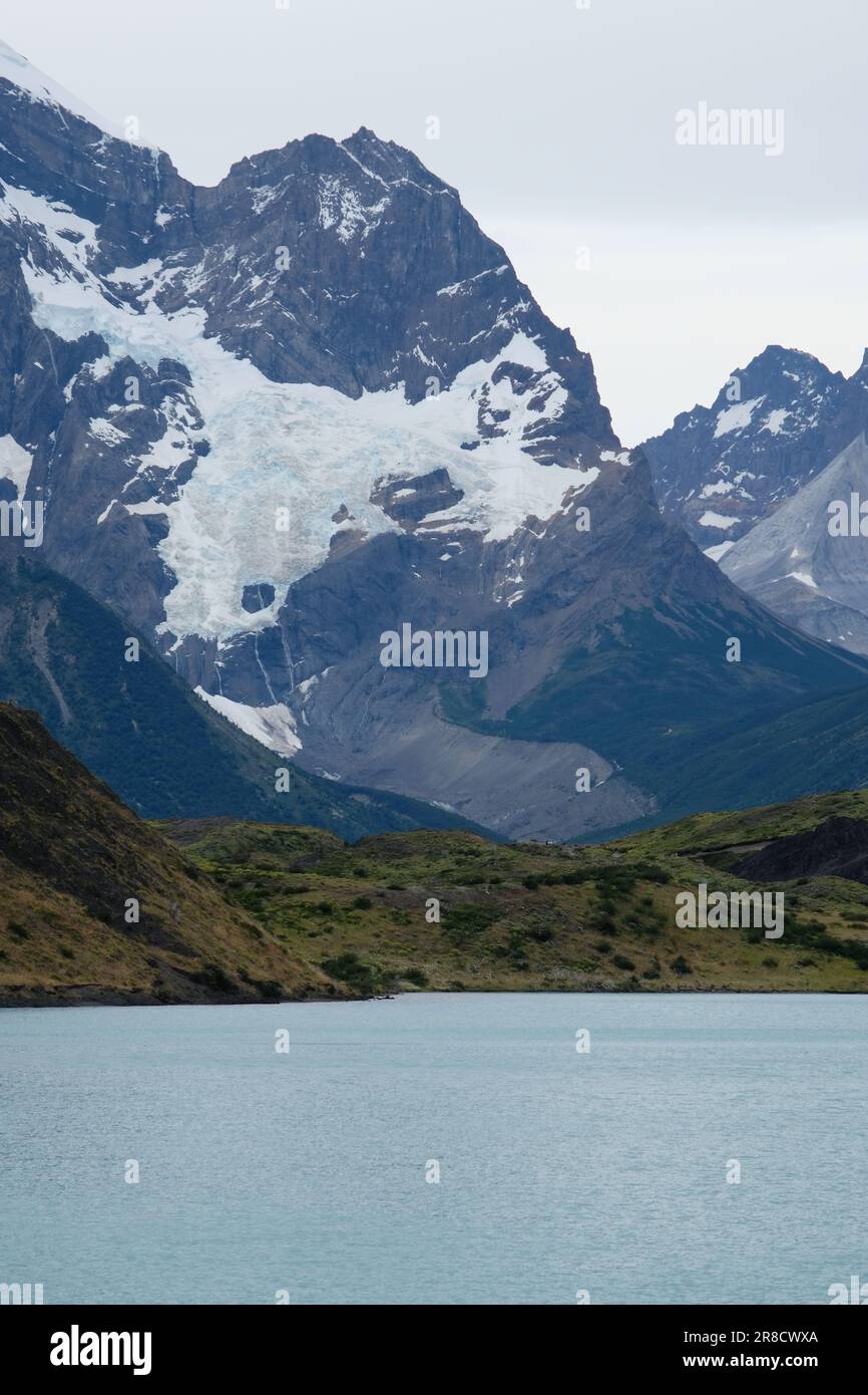 A scenic landscape featuring majestic snow-capped mountains in the ...