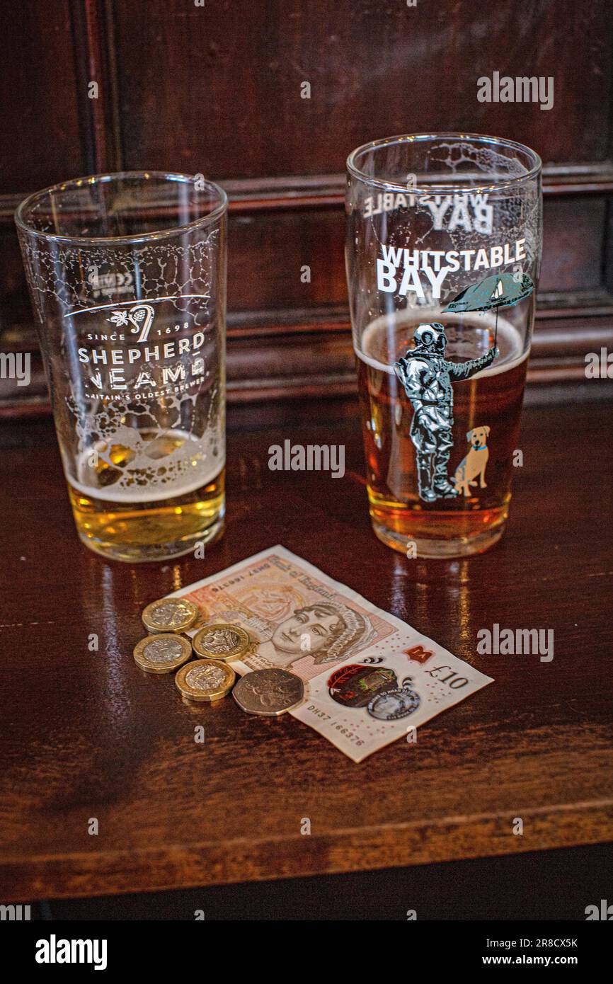 Pints of beer, Pound Sterling money, English notes, cash,City of London ...