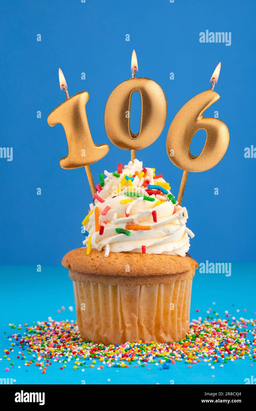 Birthday cake with candle number 106 - Blue background Stock Photo - Alamy