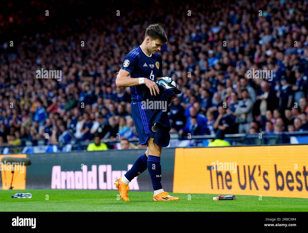 Scotland's Kieran Tierney dries the ball with a towel during the UEFA ...