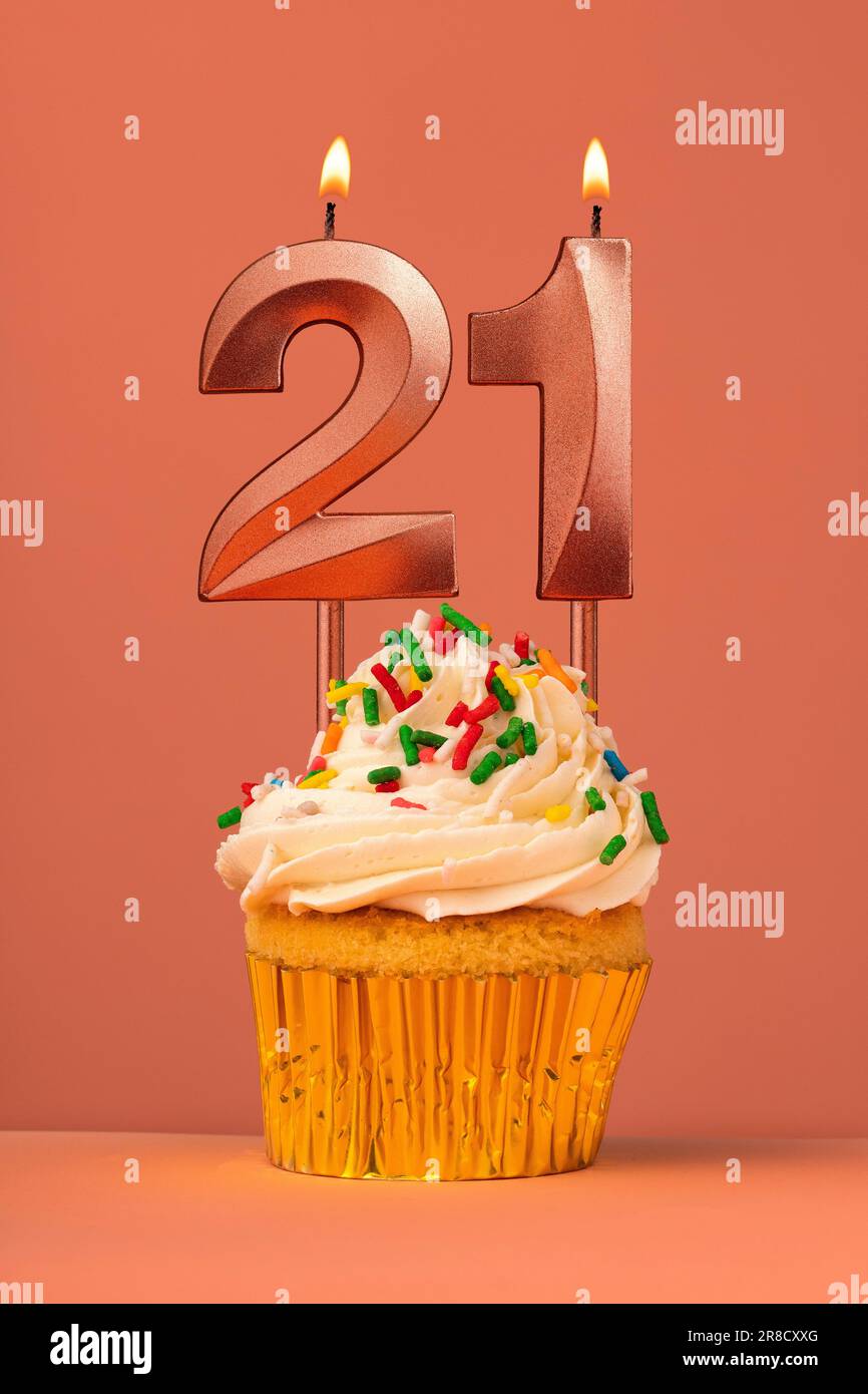 Birthday cake with candle number 21 - Coral fusion background Stock ...