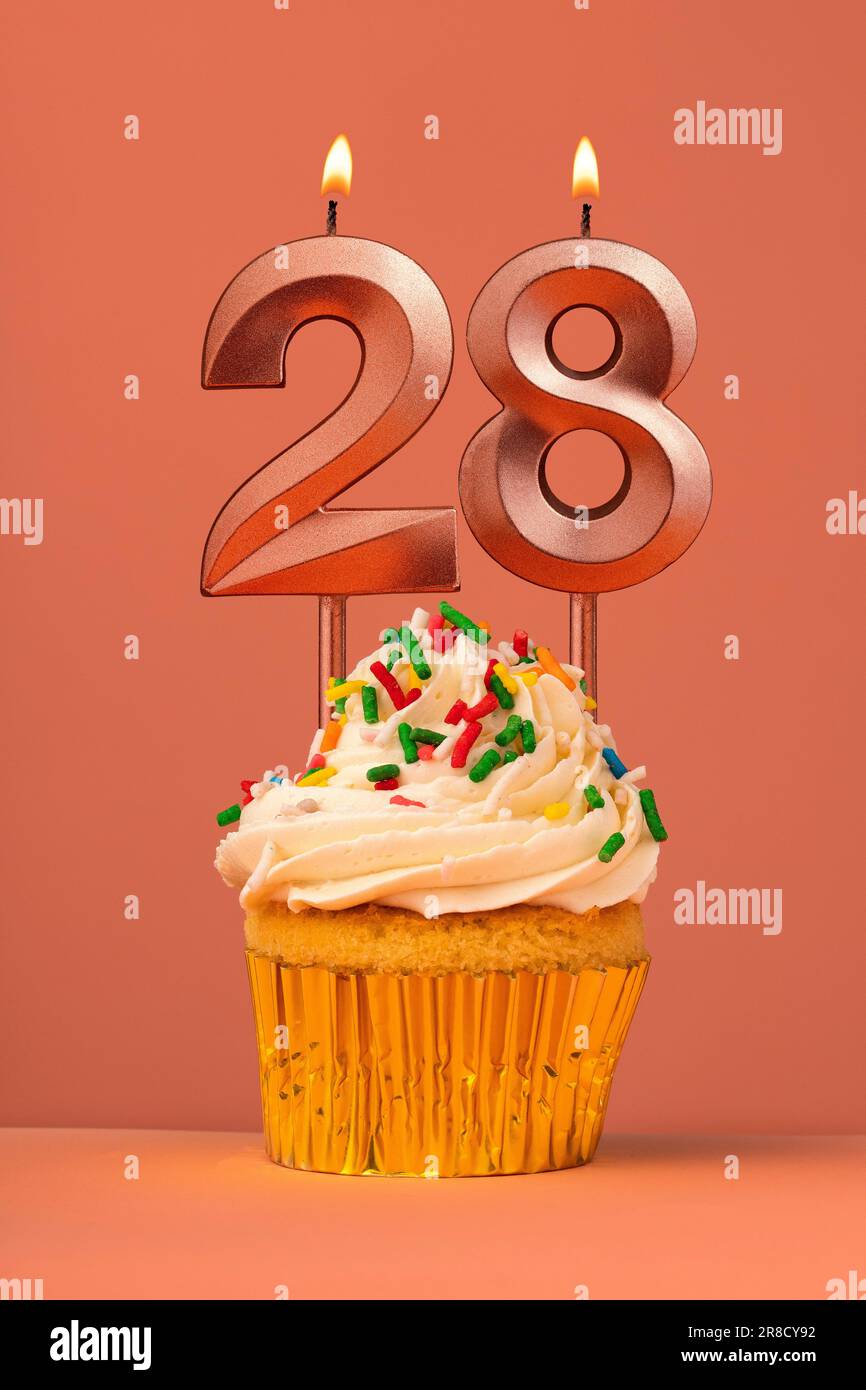Candle number 28 - Cake birthday in coral fusion background Stock Photo ...