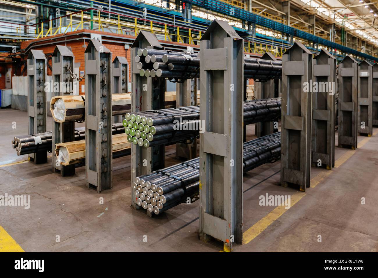 Packs of rolled metal bars on the shelves Stock Photo - Alamy