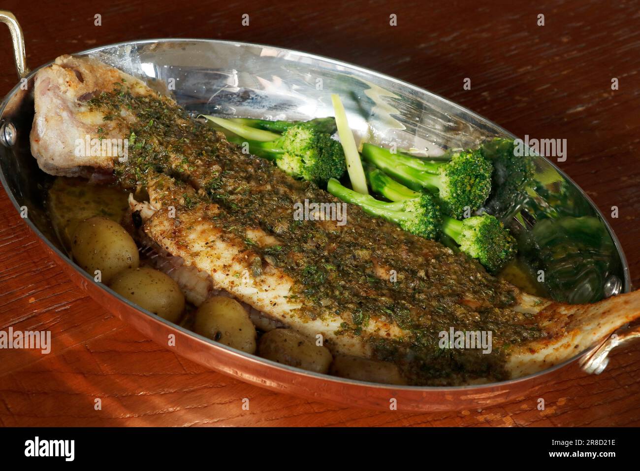 traditional french delicacy sole meuniere with green vegetables, potato ...