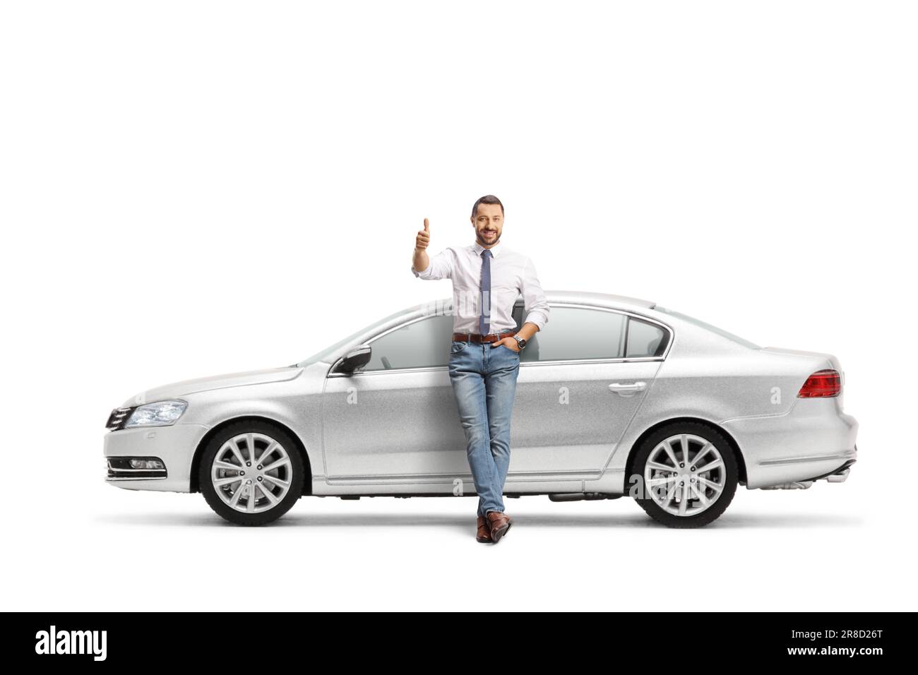 Full length portrait of a man leaning on a silver car and gesturing ...