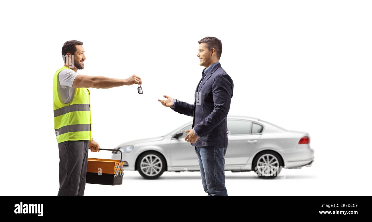 Road help agent giving car keys to a man isolated on white background ...
