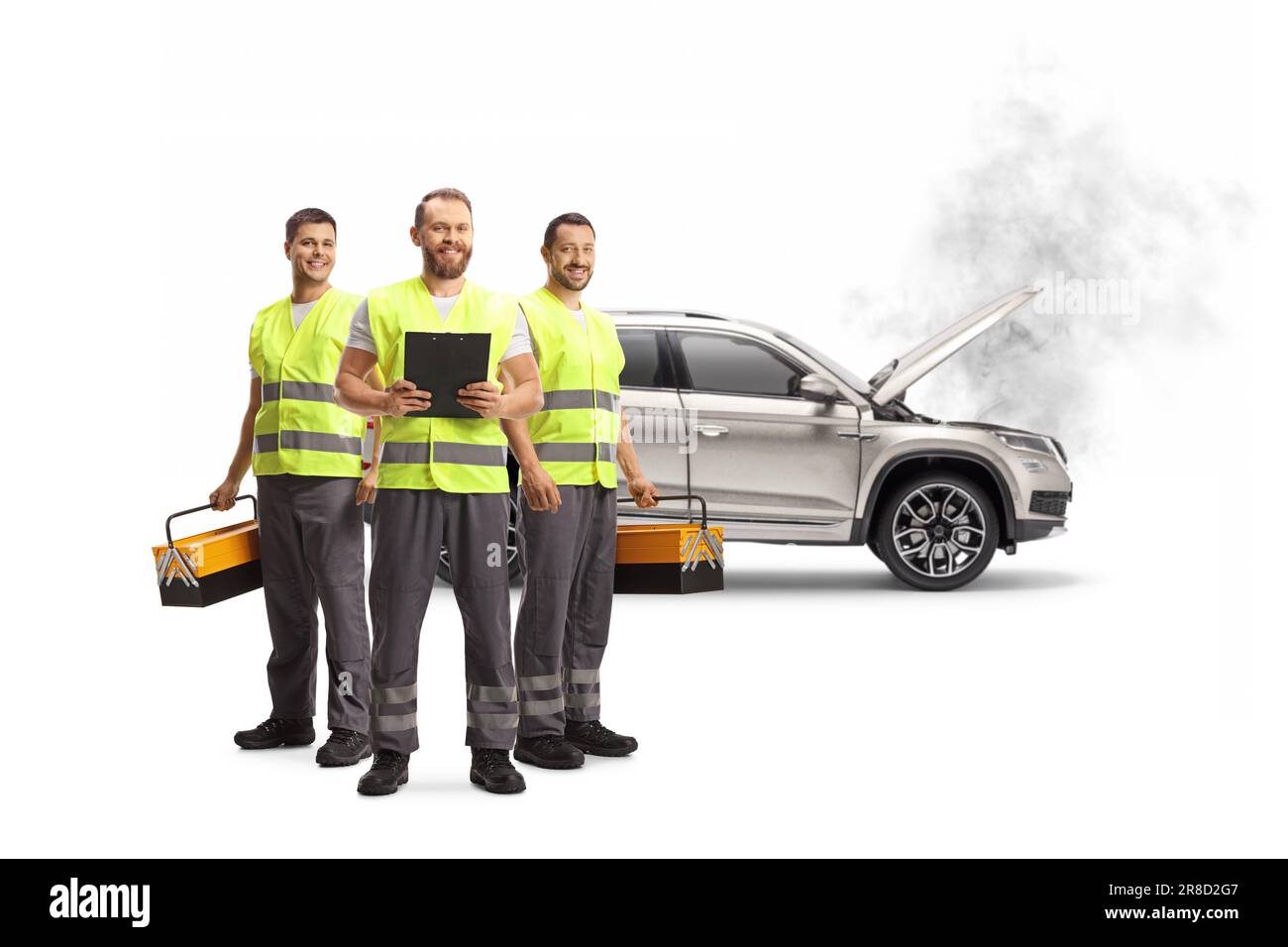 Team of road assistance workers with reflective vests standing in front ...