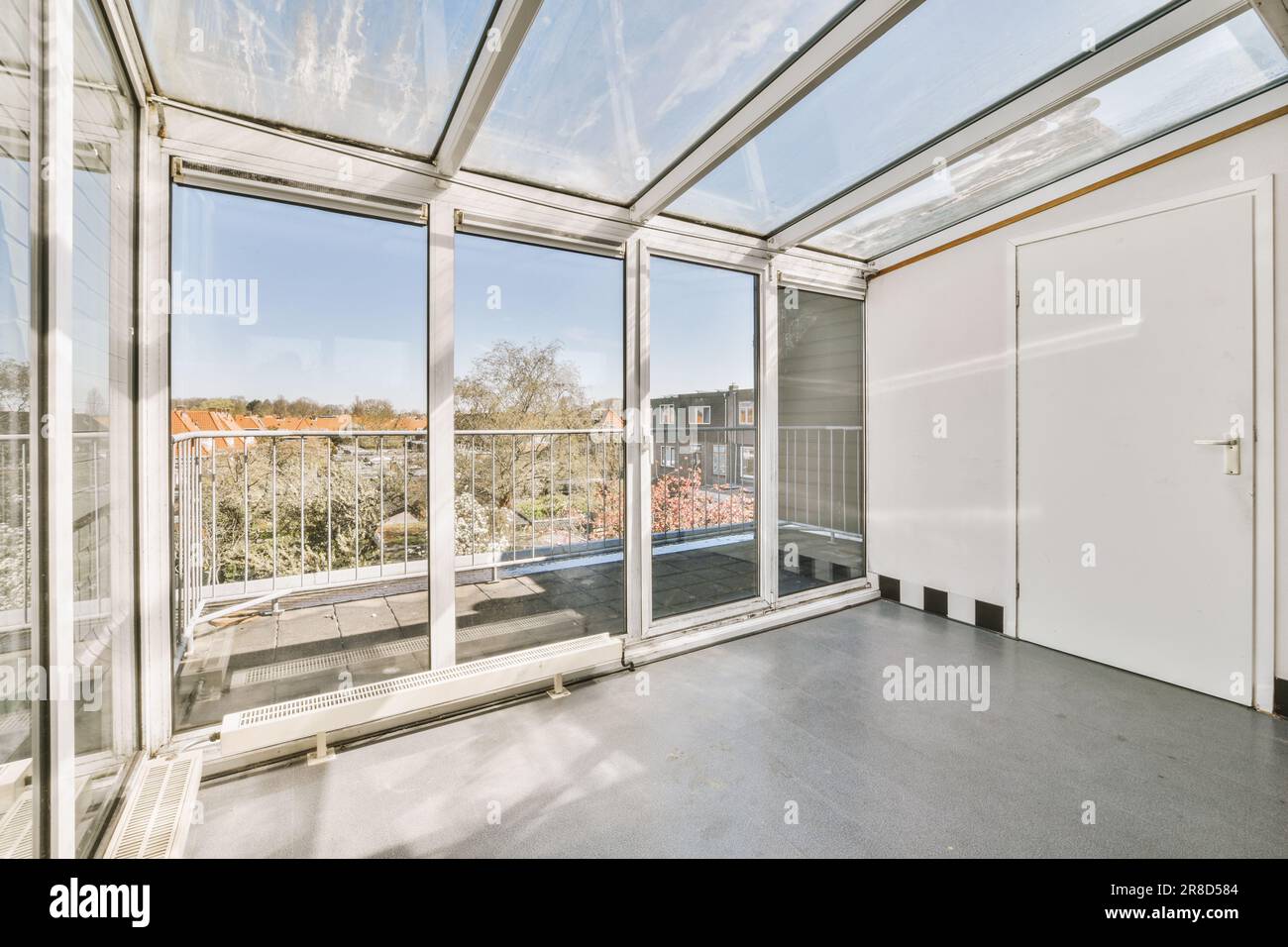 the inside of a house with large windows and skylights on either side ...