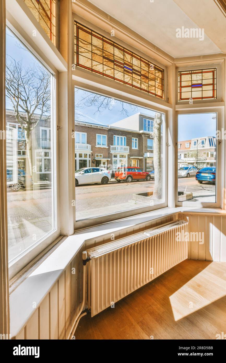 a window with a view of the street and buildings in the background ...