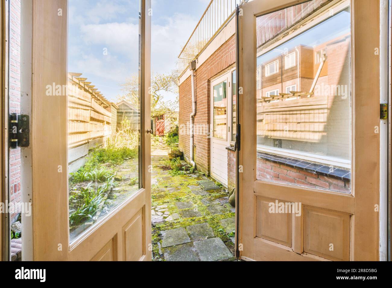 an outside view of a house from inside the front door, looking out to ...