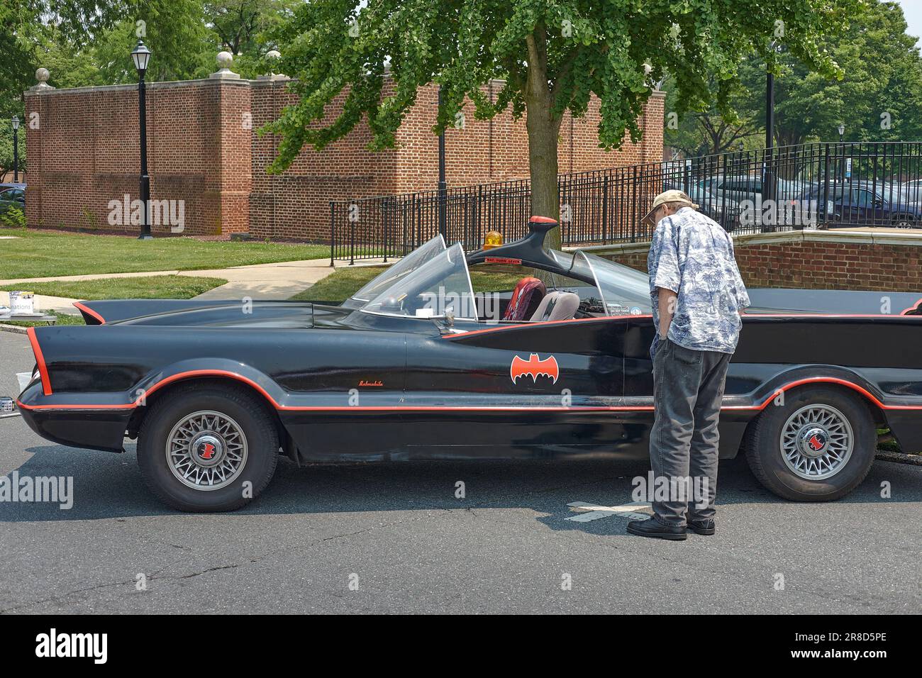 A visitor views a replica Batmobile from the 1960s television show ...