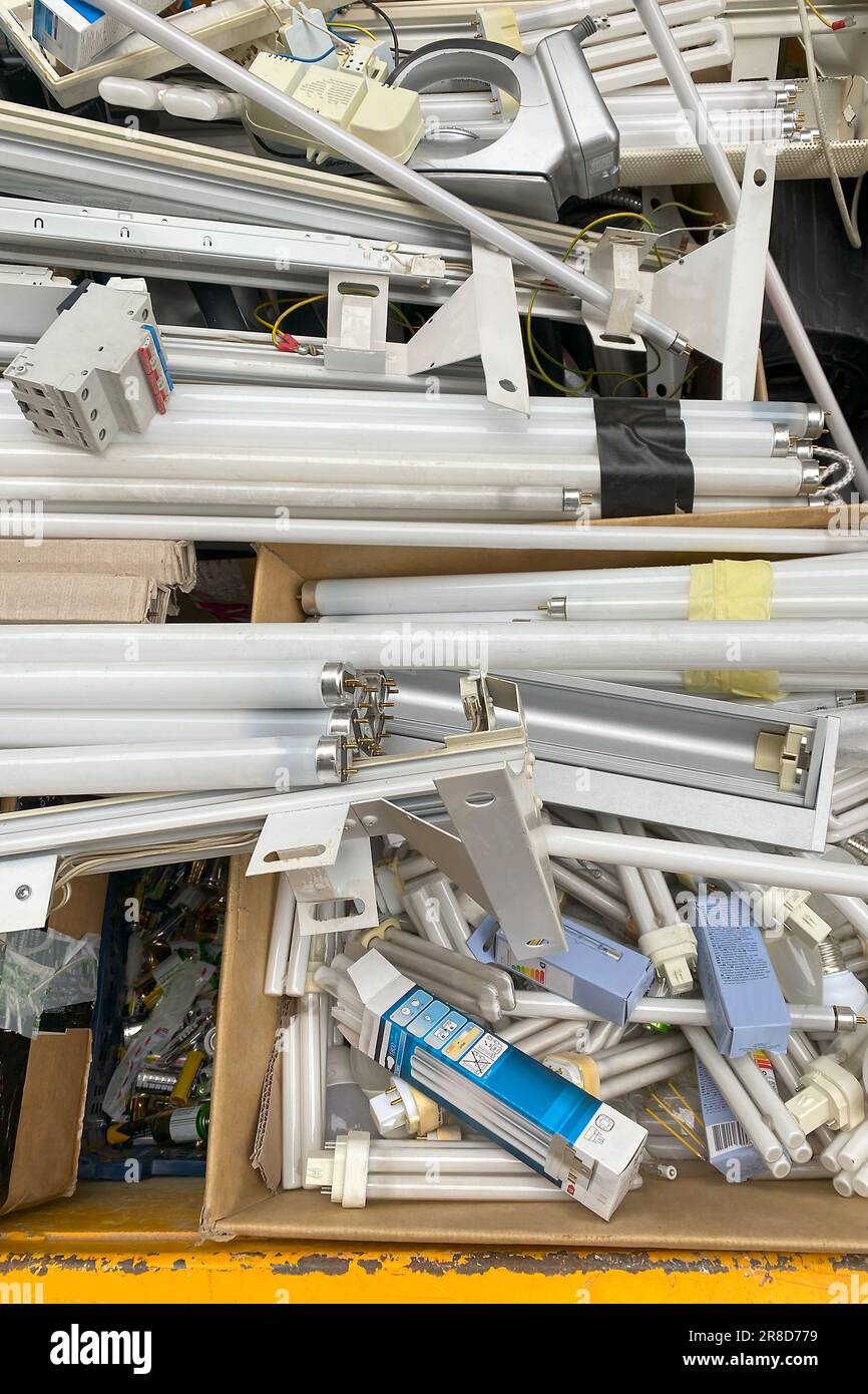 Heap of Uld used Fluorescent light tube lamps in dump trash and varios ...