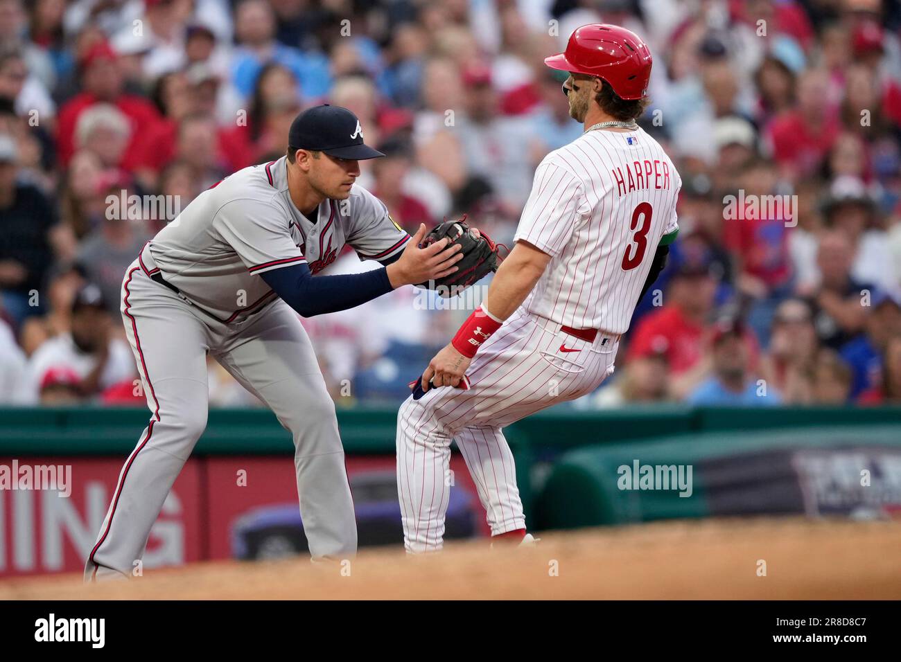 Philadelphia Phillies' Bryce Harper, right, is tagged out at third by ...