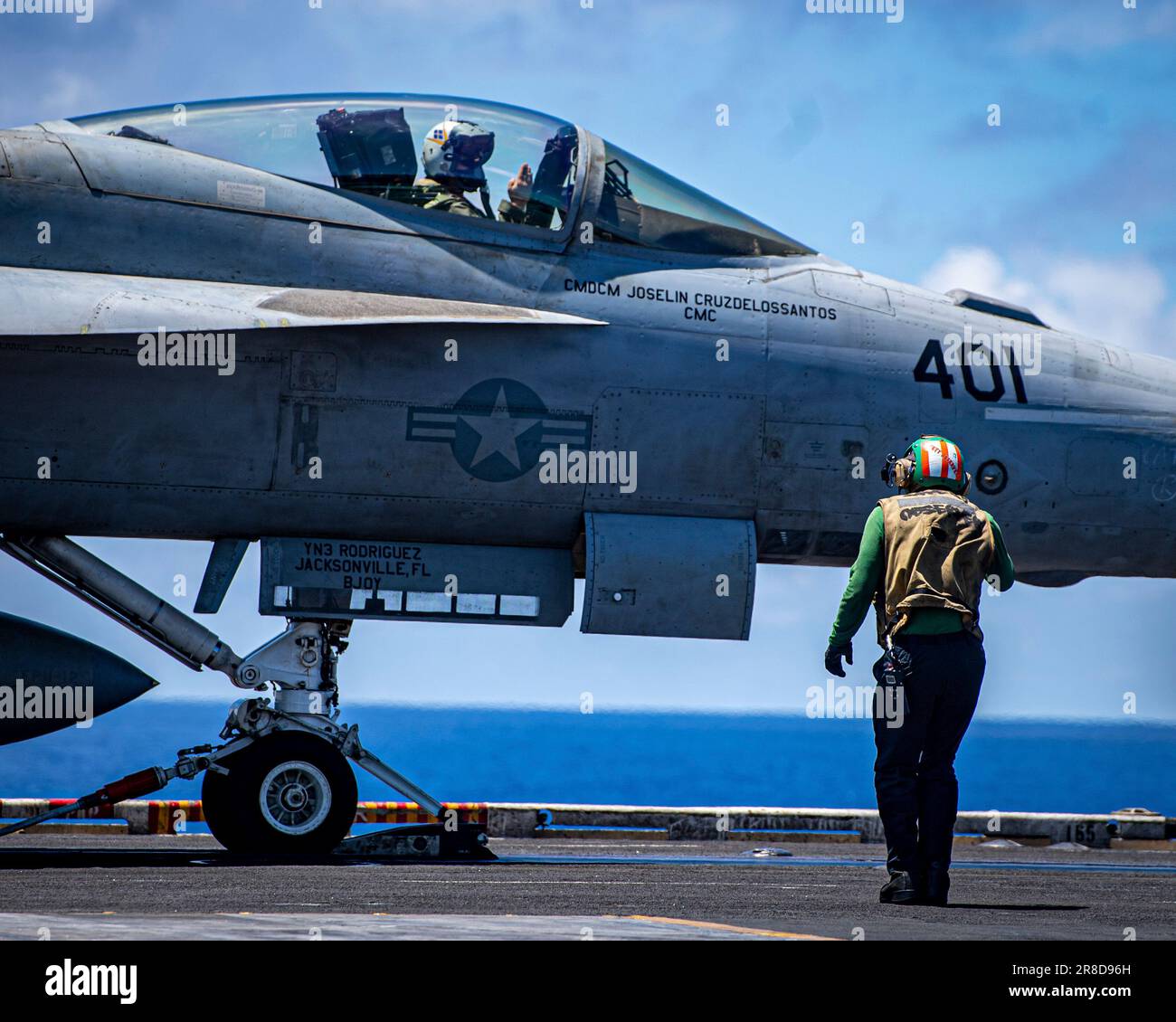 230618-N-XK462-1044 PACIFIC OCEAN (June 18, 2023) A U.S. Navy Sailor directs an F/A-18E Super ...