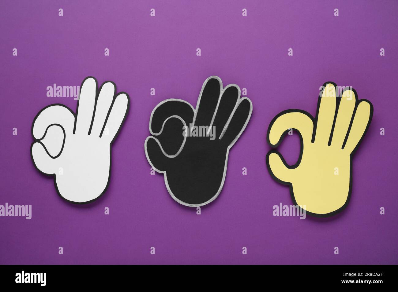 Paper cutouts of Okay hand gesture on purple background, top view Stock ...