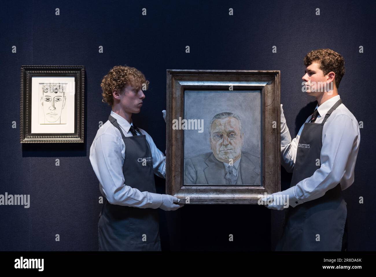 LONDON, UNITED KINGDOM - JUNE 20, 2023: Art handlers hold a painting ...