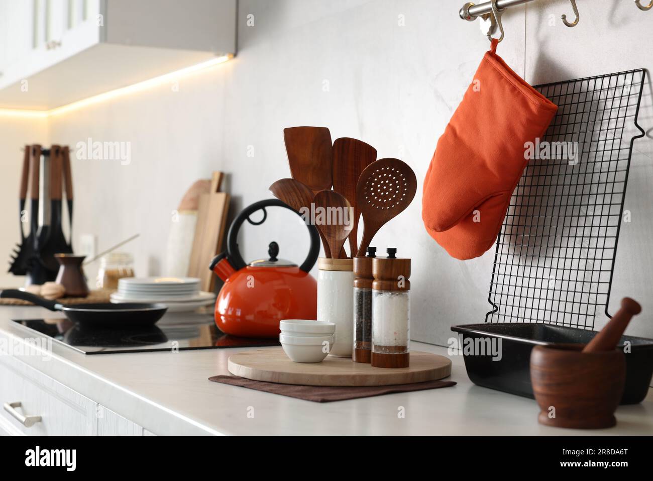 Set of different utensils and dishes on countertop in kitchen Stock ...