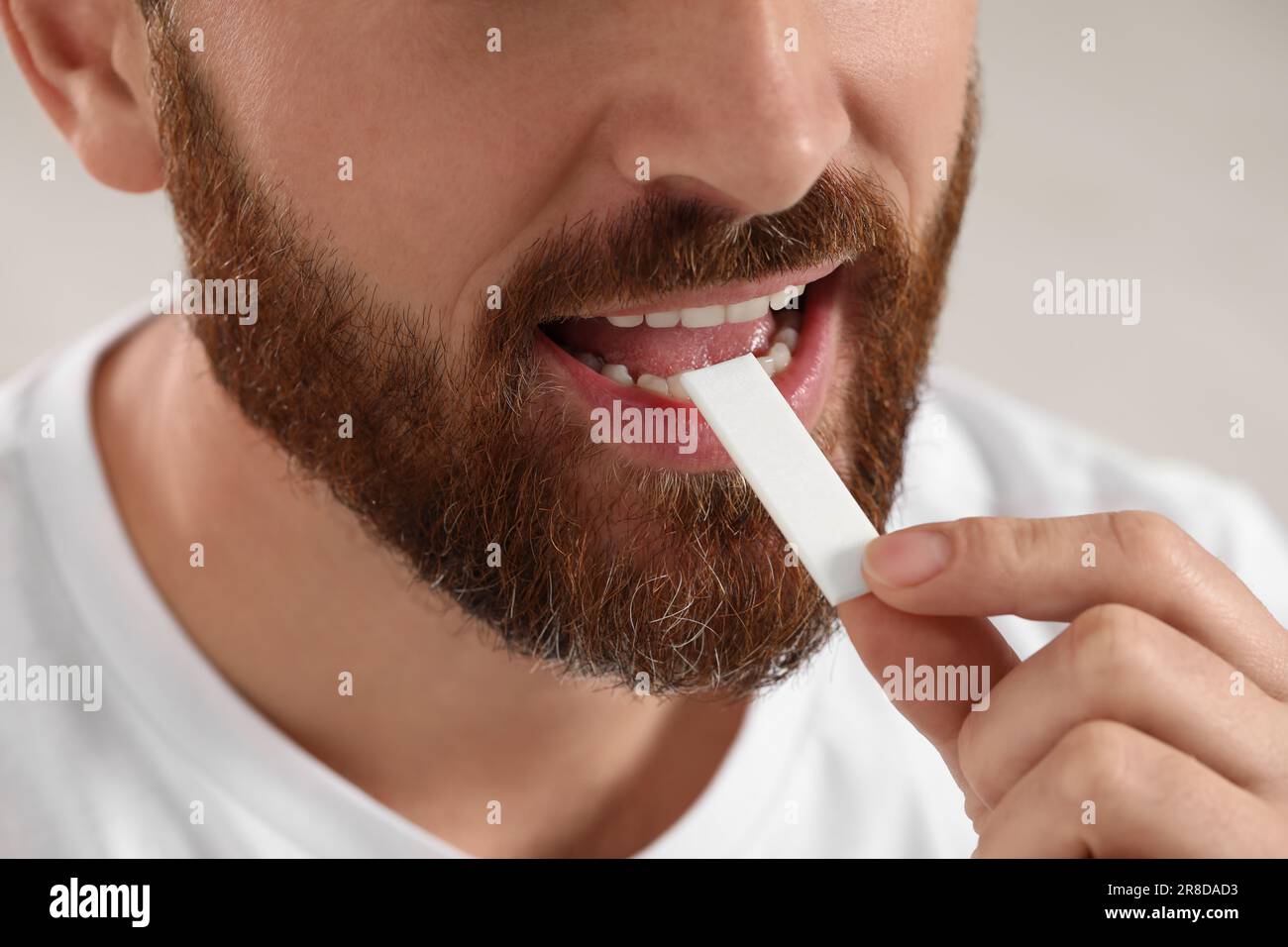 Putting food into his mouth hi-res stock photography and images - Alamy