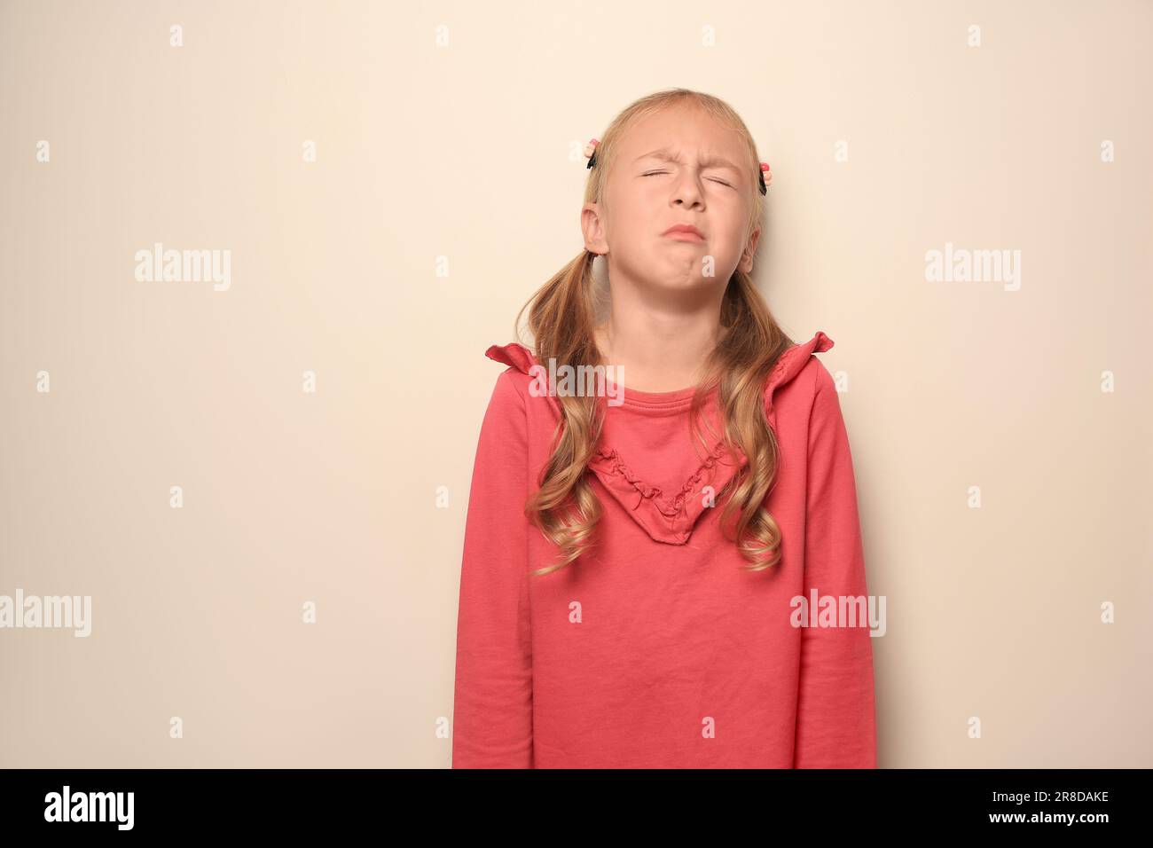 Cute little girl crying on light background. Space for text Stock Photo ...