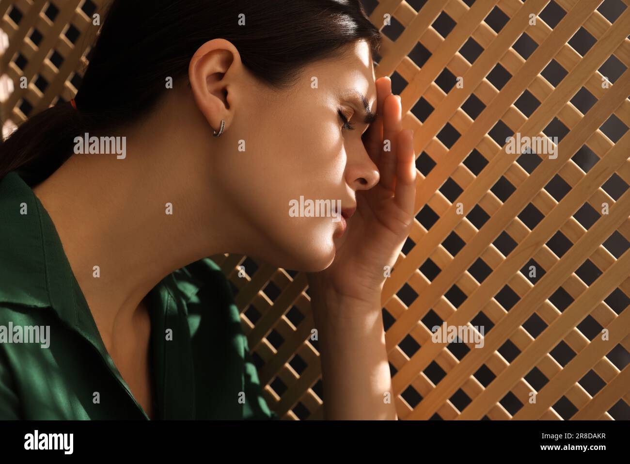 Young woman during confession in church hi-res stock photography and ...