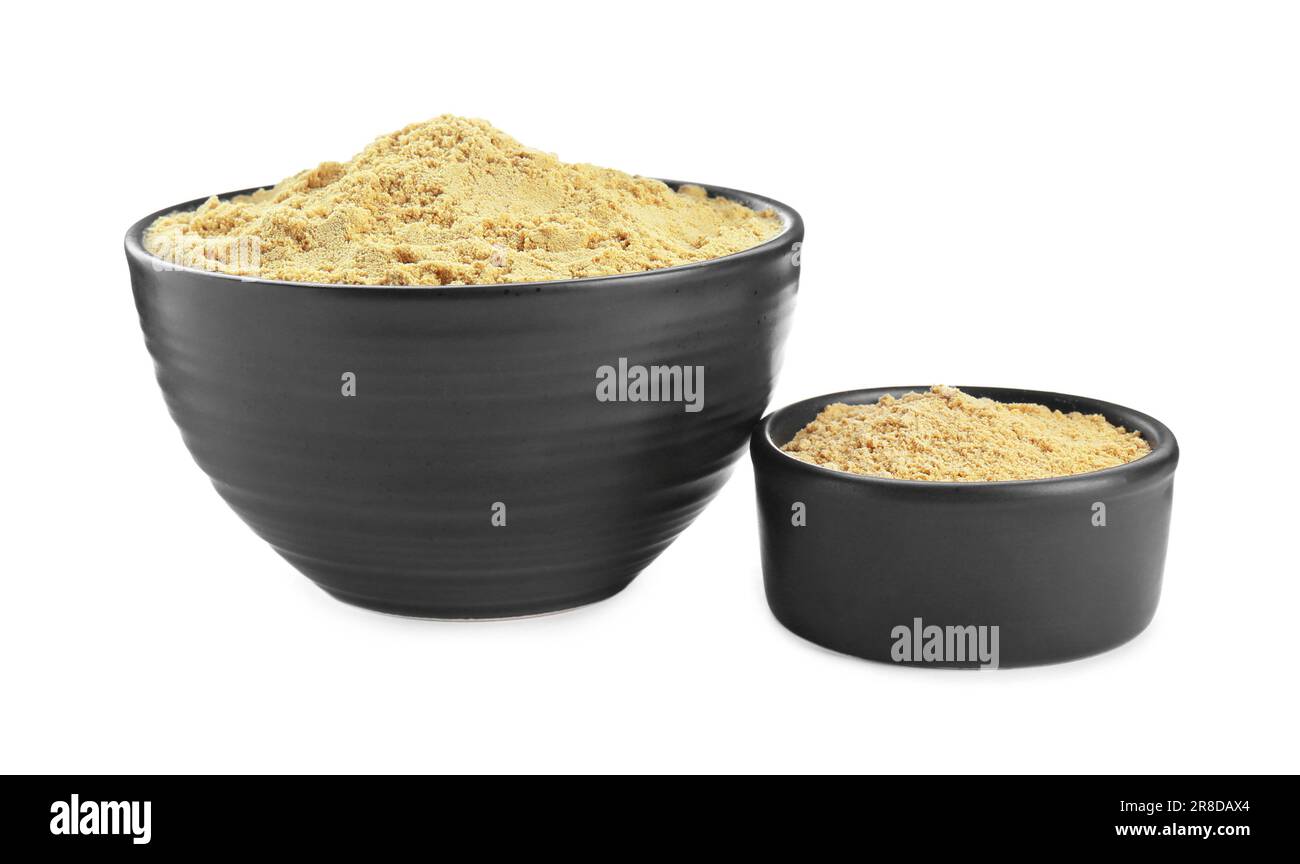Bowls with aromatic mustard powder on white background Stock Photo - Alamy