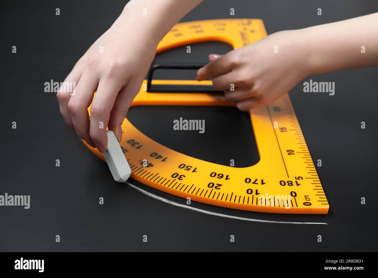 Hands measuring angle by protractor hi-res stock photography and images ...