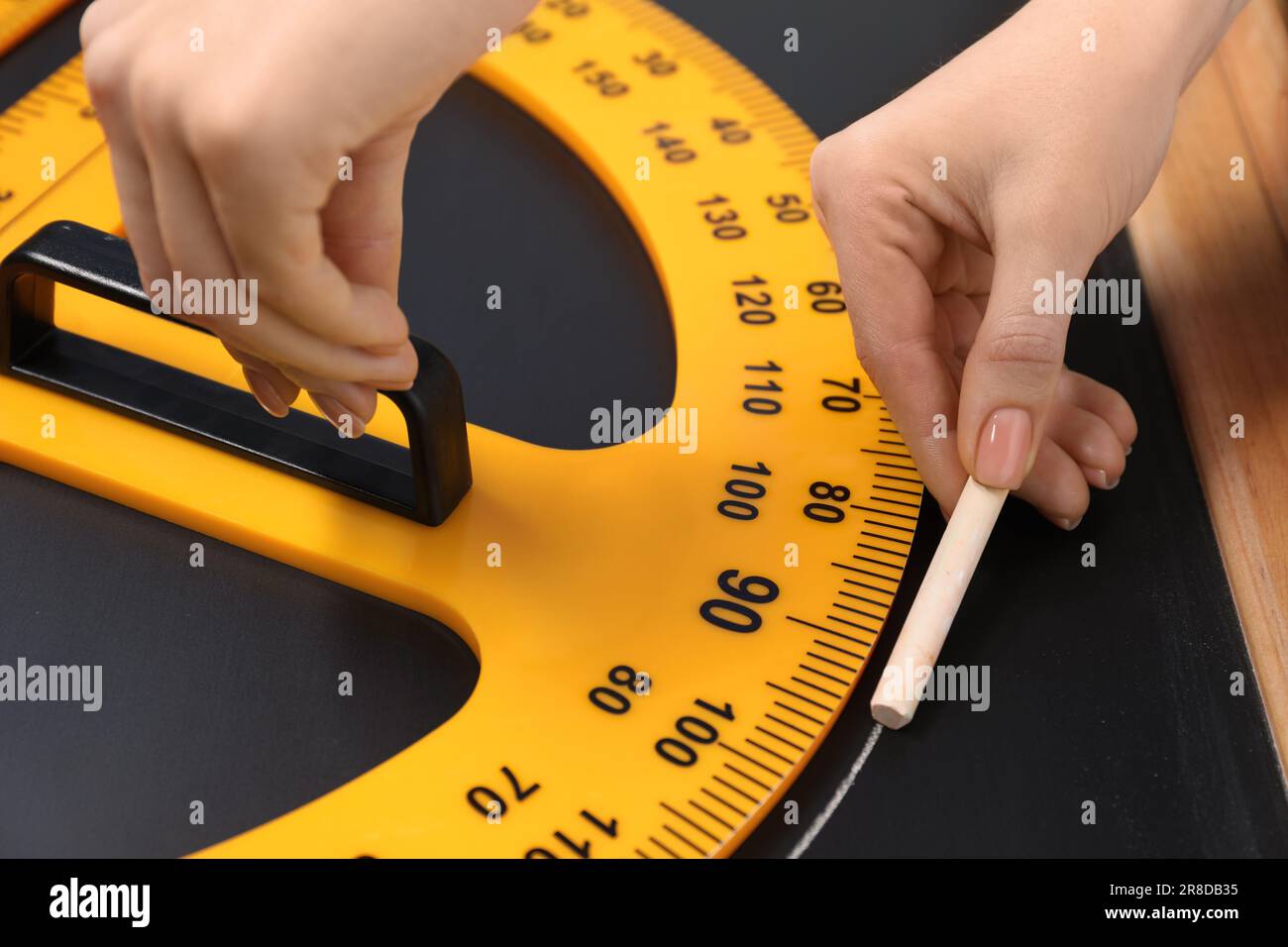 Hands measuring angle by protractor hi-res stock photography and images ...