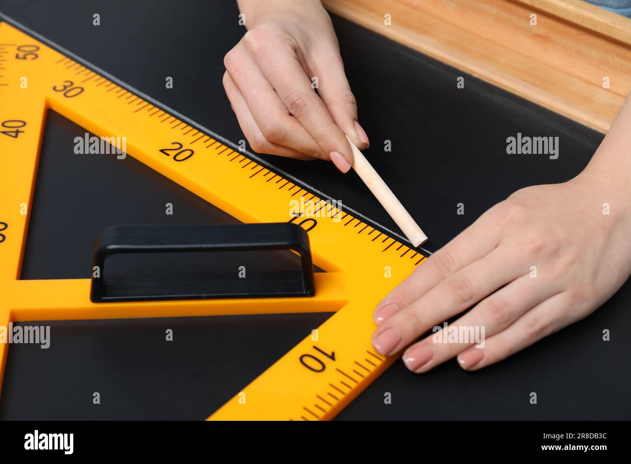Hands measuring angle by protractor hi-res stock photography and images ...