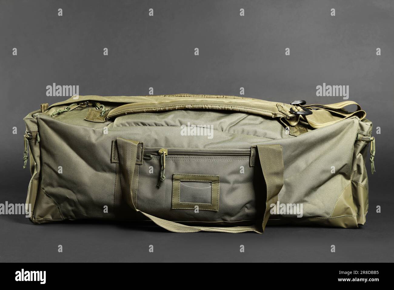 Army bag on dark grey background. Military equipment Stock Photo - Alamy
