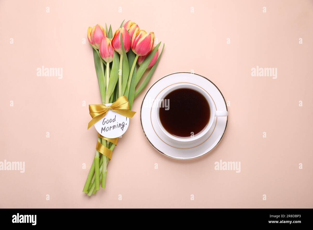 Cup of coffee, beautiful tulips and card with text Good Morning on ...