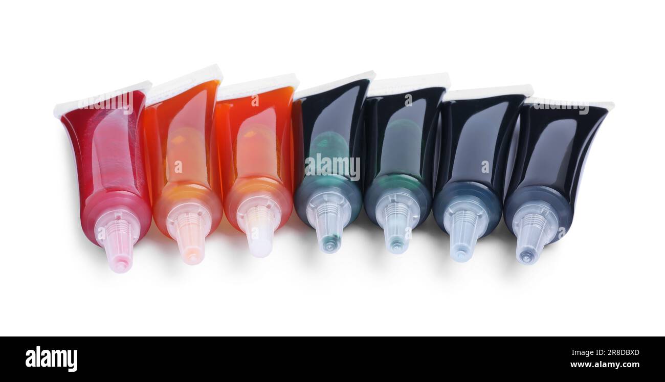Tubes with different food coloring on white background Stock Photo - Alamy