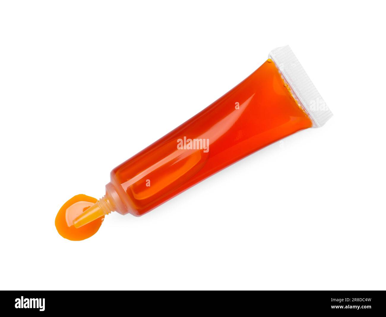 Tube with orange food coloring isolated on white, top view Stock Photo ...