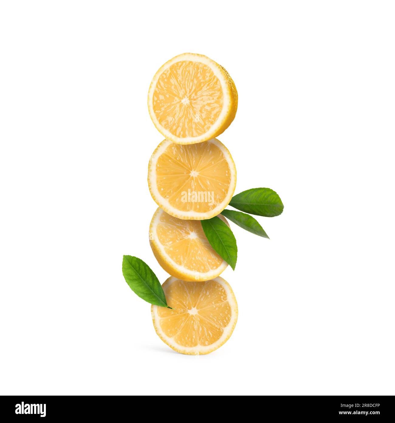 Stack of cut fresh lemons with green leaves isolated on white Stock ...
