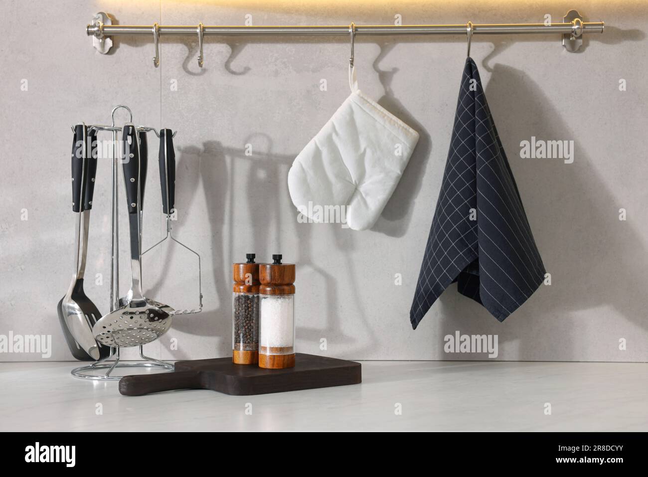 Set of different utensils on countertop in kitchen Stock Photo - Alamy