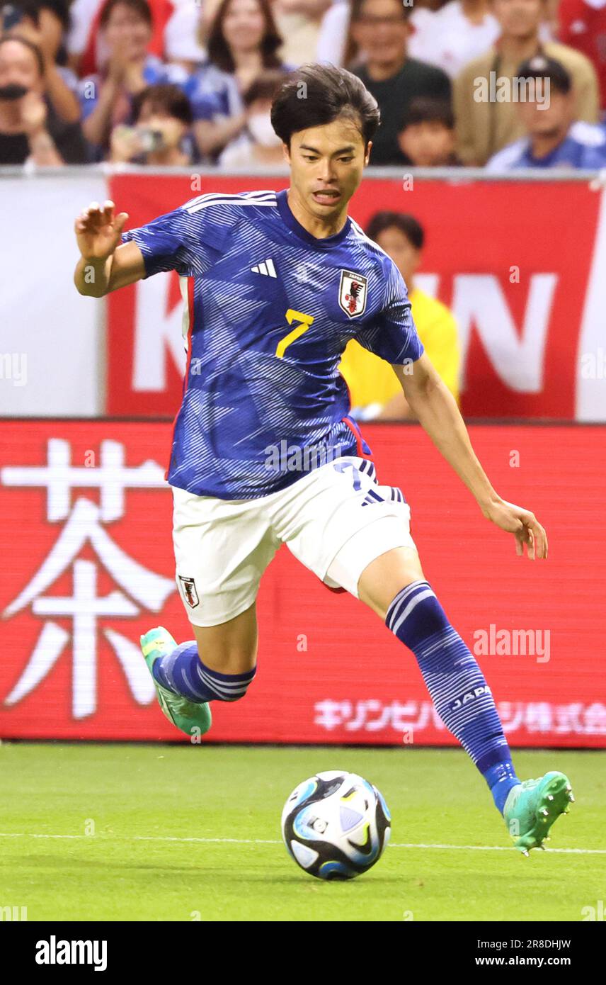 Suita, Japan. 20th June, 2023. Japan's Kaoru Mitoma carries the ball ...