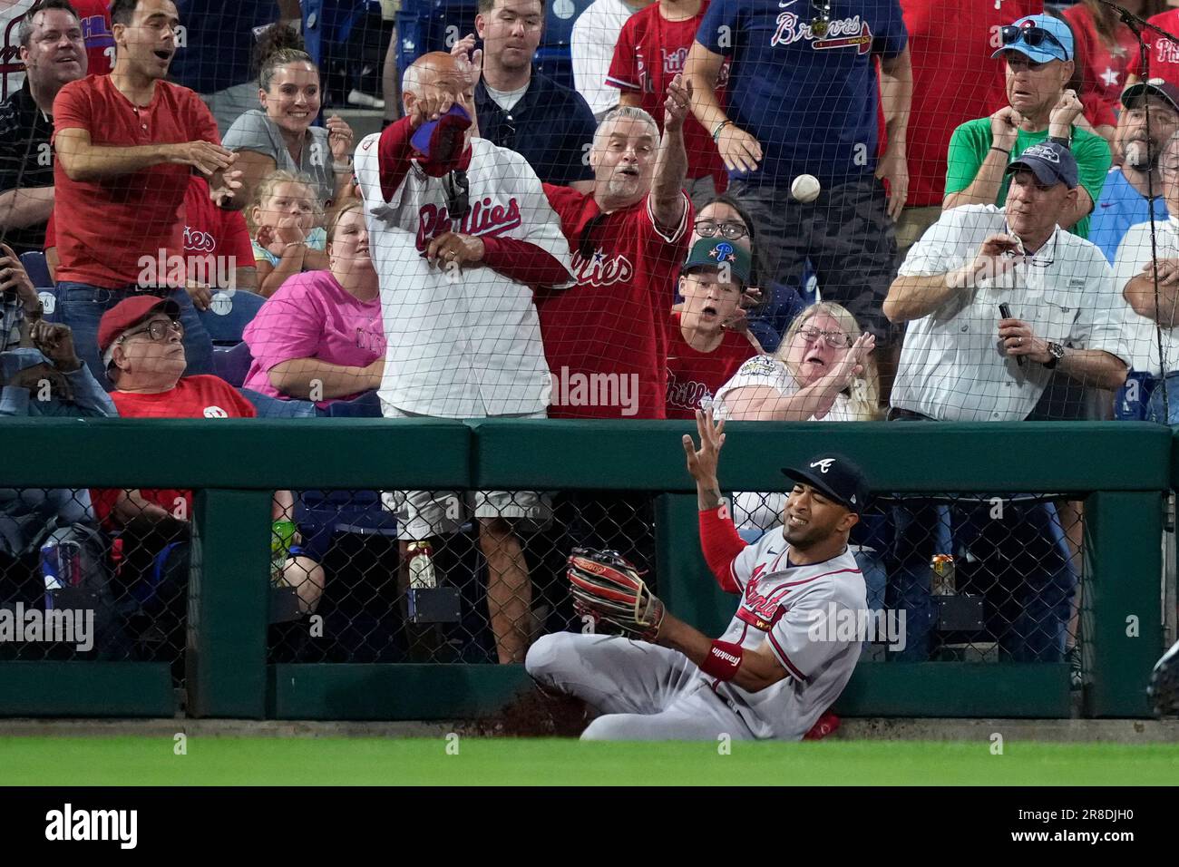 Atlanta Braves left fielder Eddie Rosario cannot reach a foul ball by ...