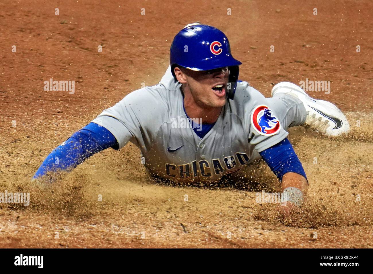 Chicago Cubs' Nico Hoerner scores on a sacrifice by by Seiya Suzuki off ...