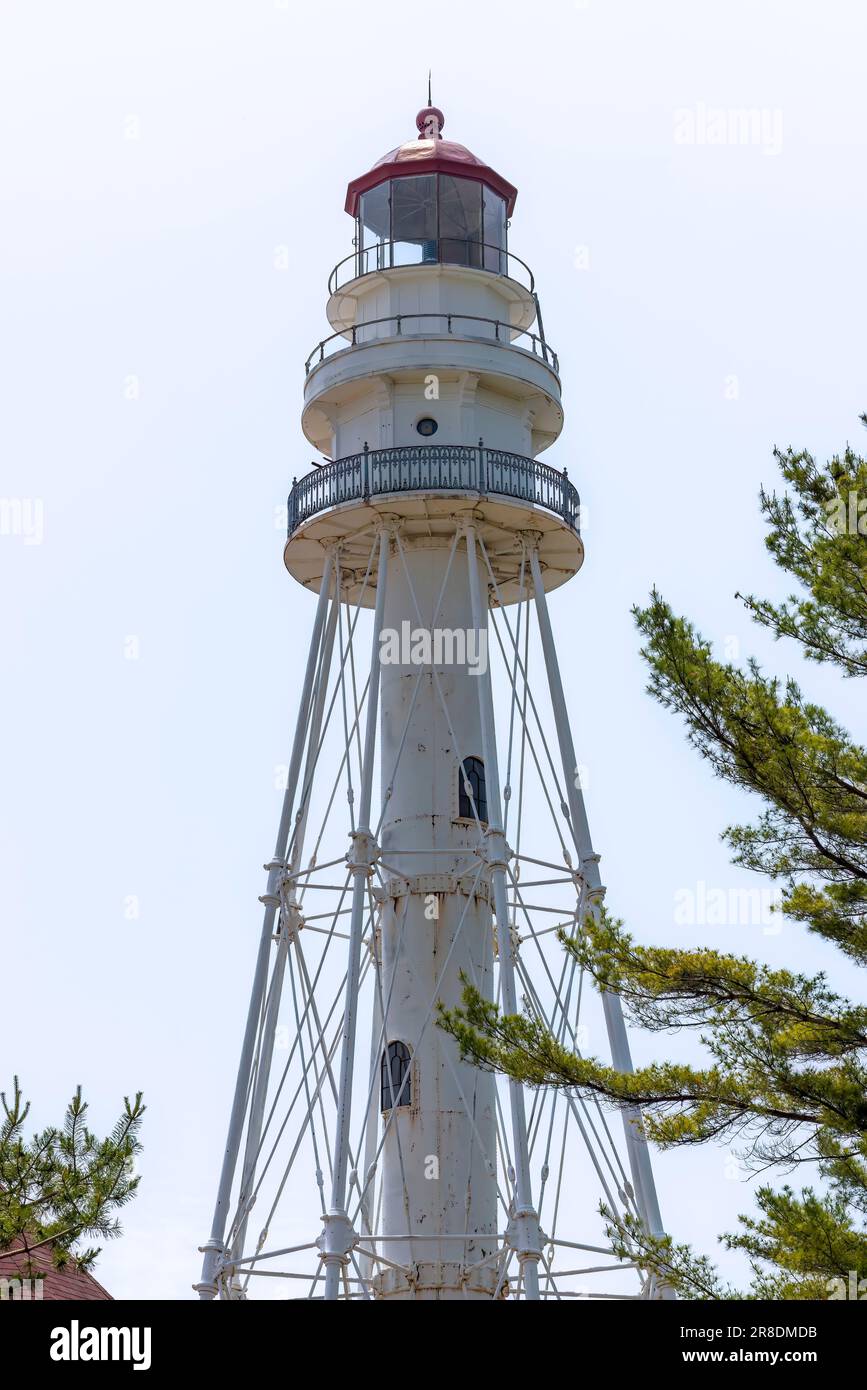 A lighthouse on the shore of Lake Michigan in a state park in Two ...