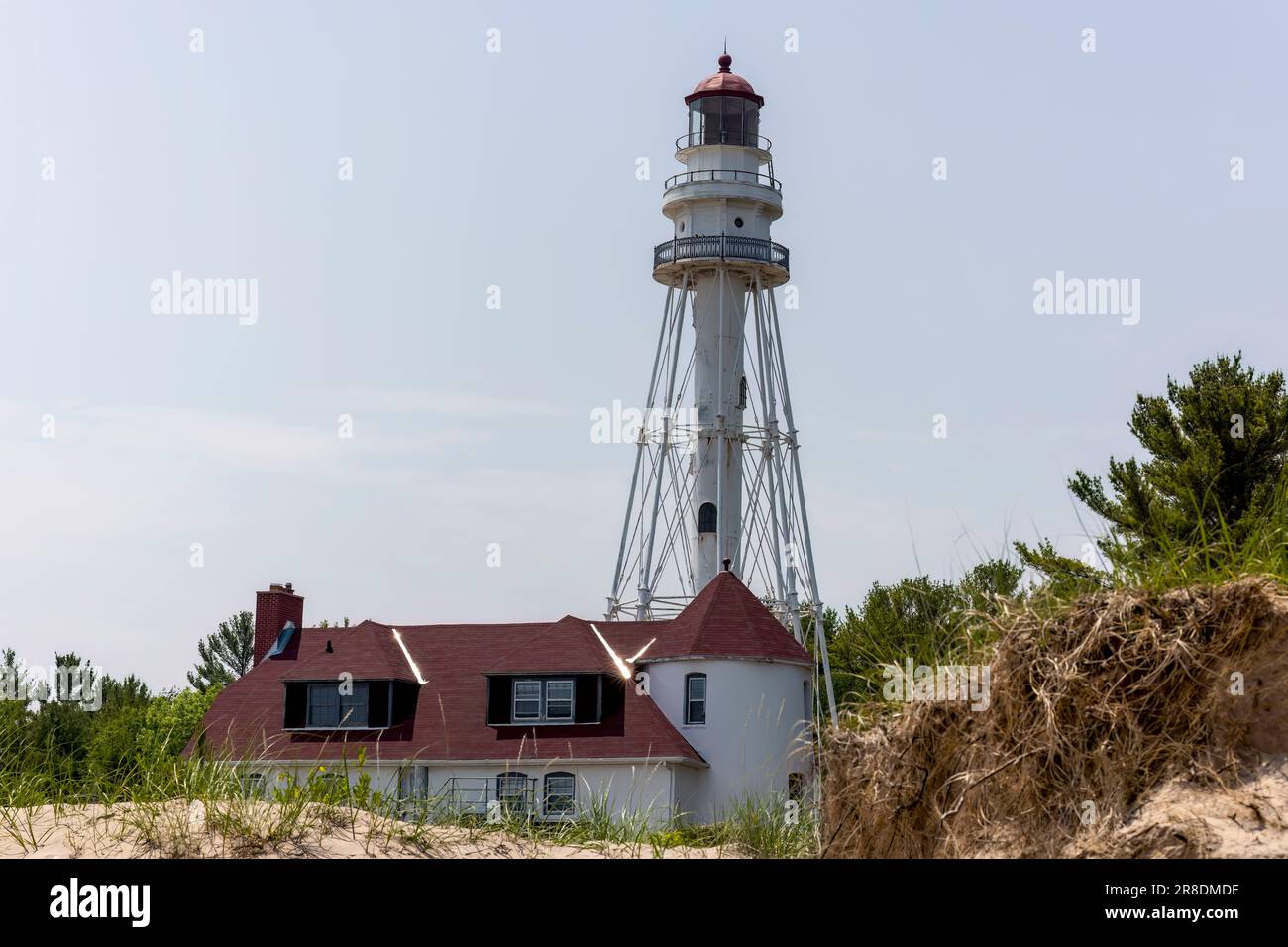 A lighthouse on the shore of Lake Michigan in a state park in Two ...