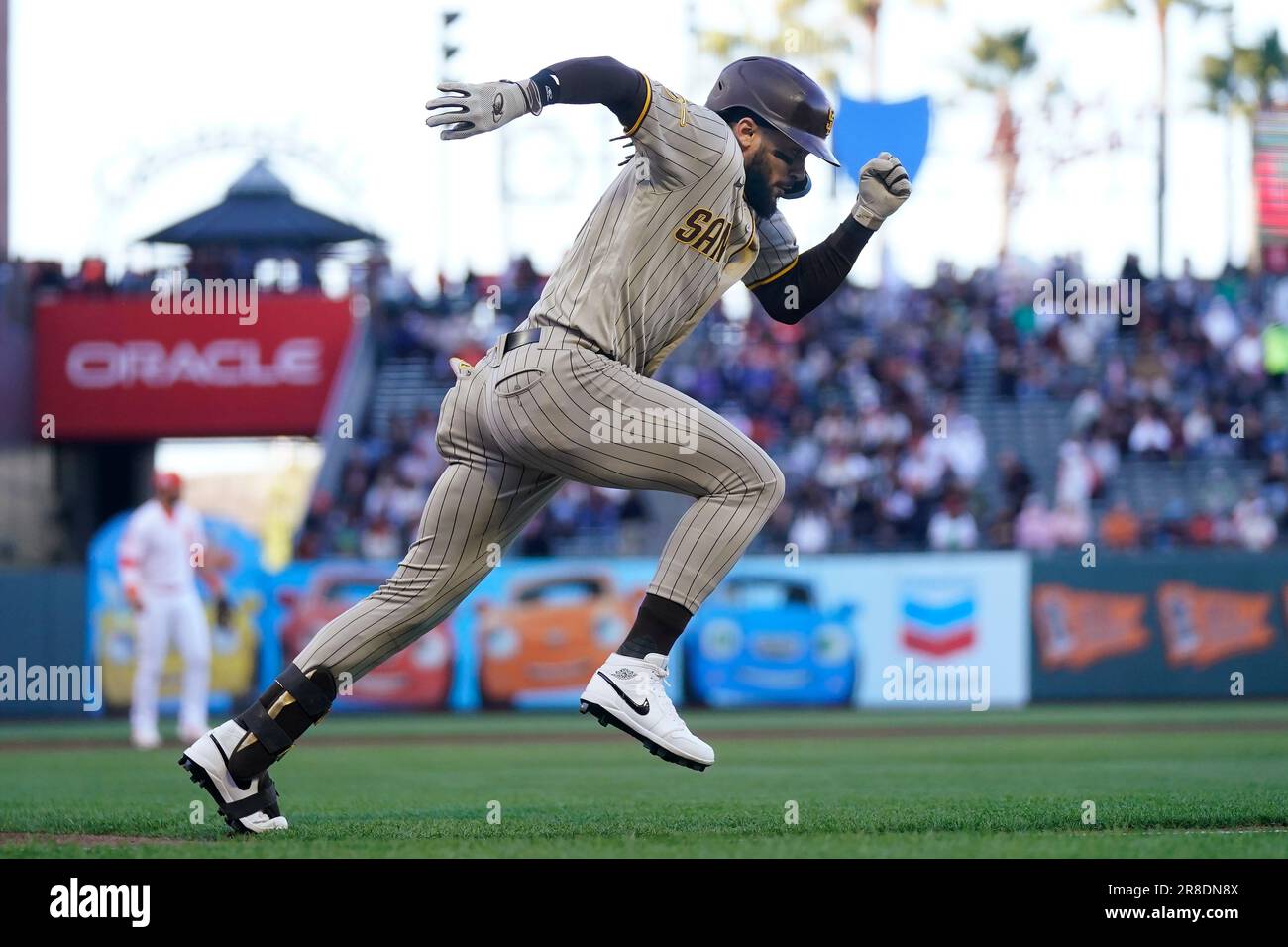 San Diego Padres' Fernando Tatis Jr. runs to first base after hitting a ...