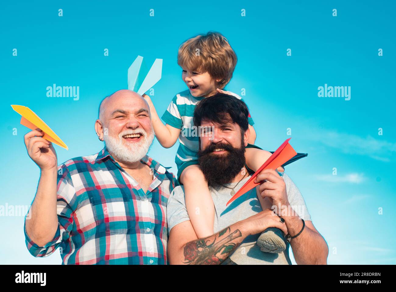 Child pilot aviator with paper airplane dreams of traveling. Fathers ...