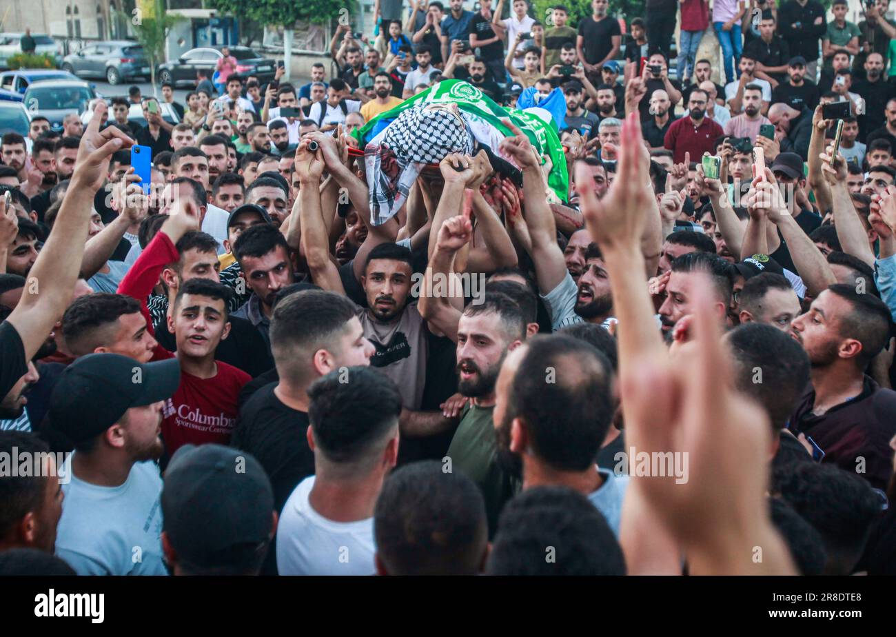 (EDITOR'S NOTE: Image depicts death) Mourners carry the body of the ...
