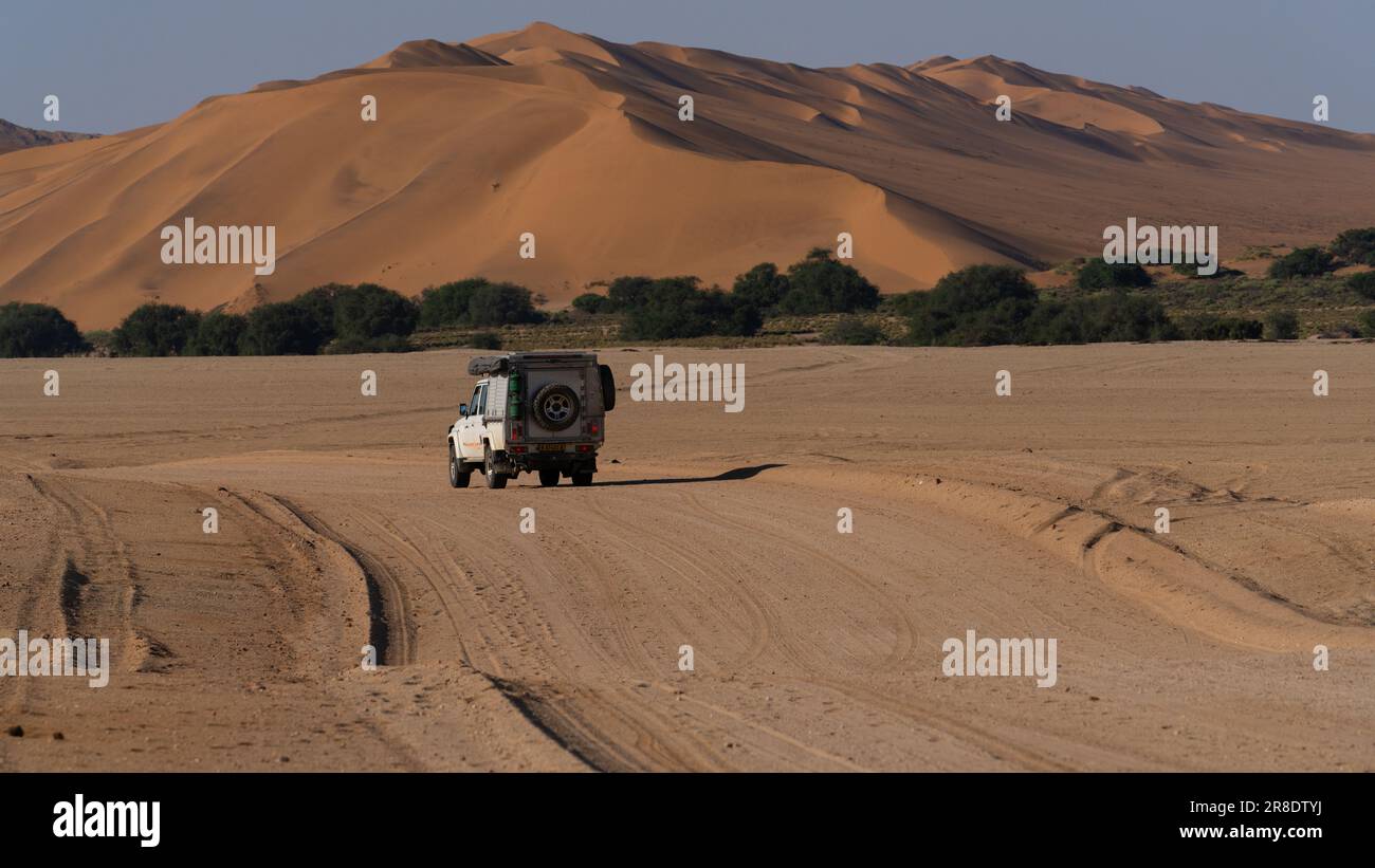 4x4 overlanding through the sand dunes in the Namib desert, Namibia ...