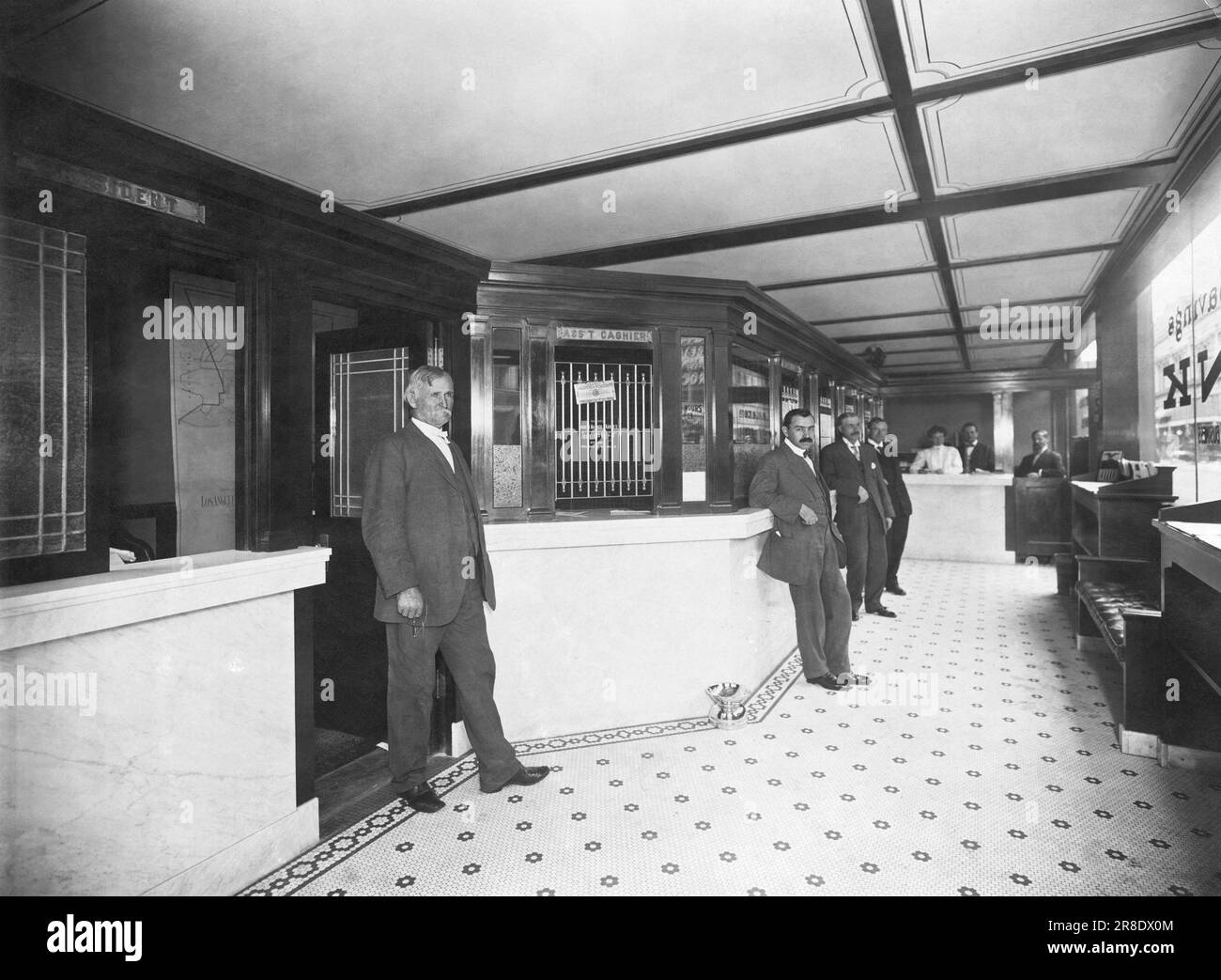 Los Angeles, California: c. 1912 Bank employees gather for a portrait ...