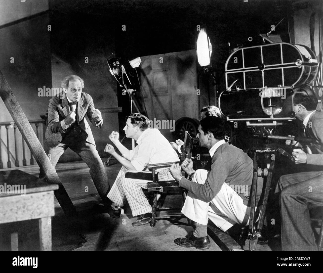 Hollywood, California: c. 1918 A silent film crew gestures for the ...