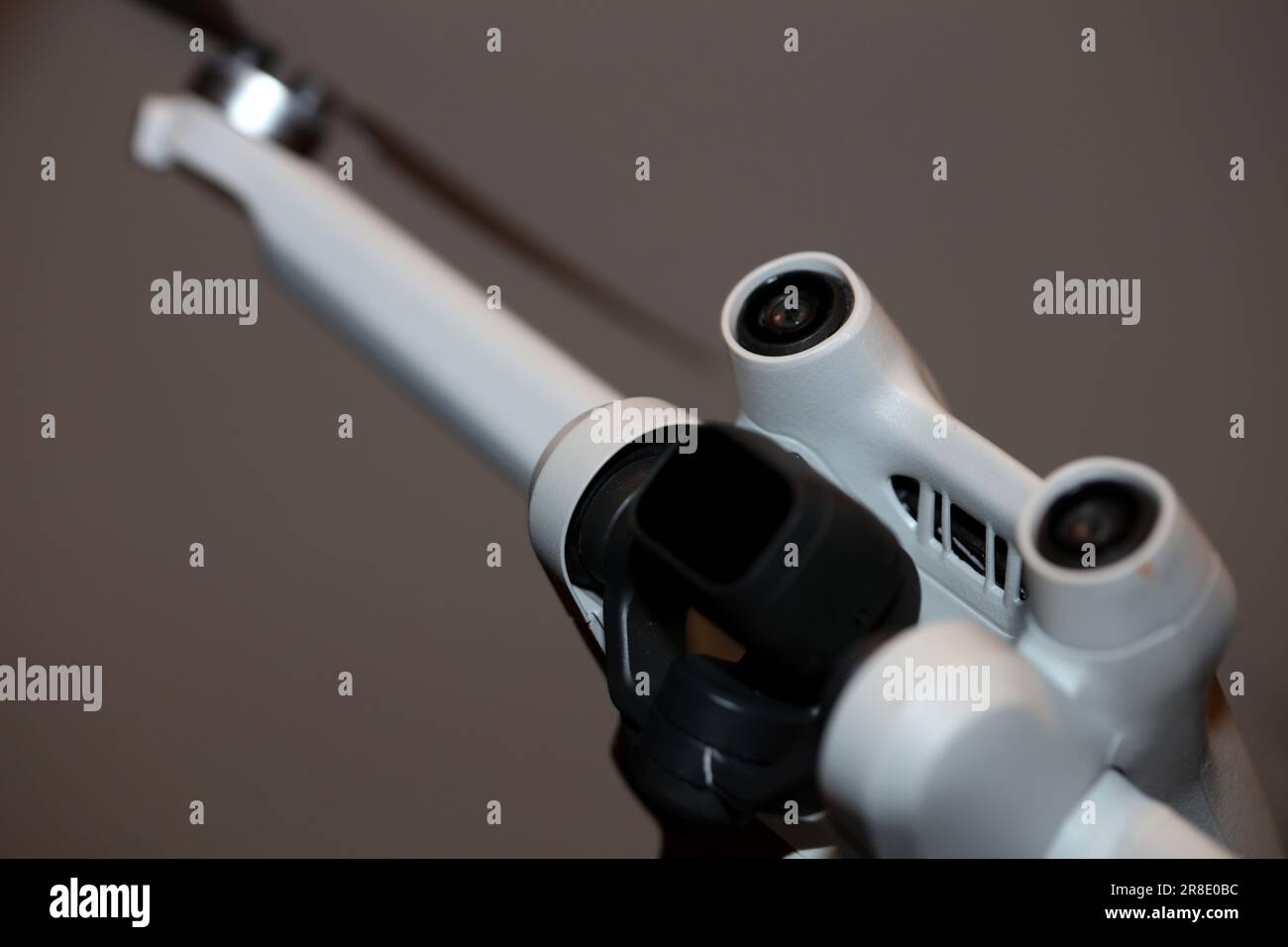 The drone copter flying with digital camera isolated on empty colorful ...