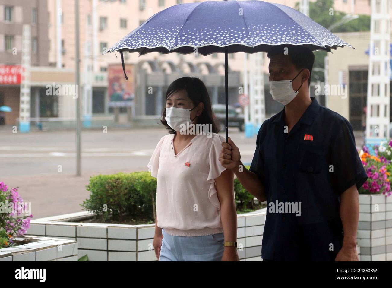 Citizens walk in a street in front of Pyongyang Railway Station in ...